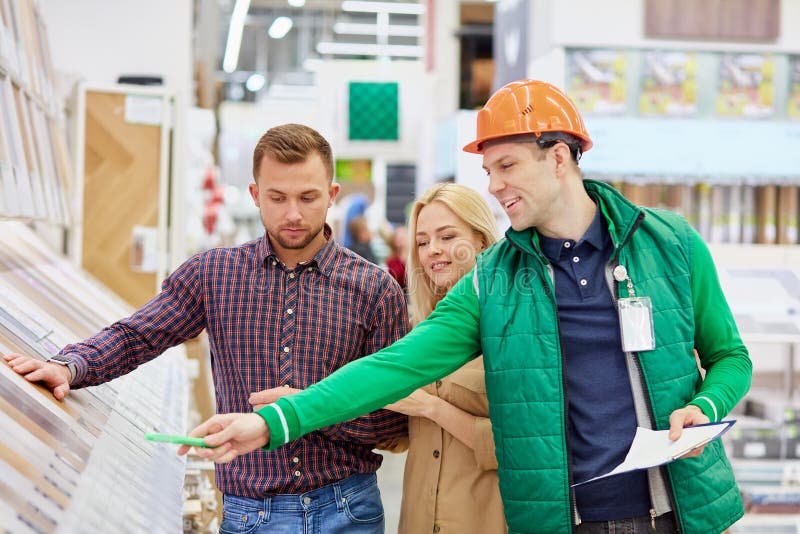 Couple Customers Asked for Help and Advice from Warehouse Worker Stock ...