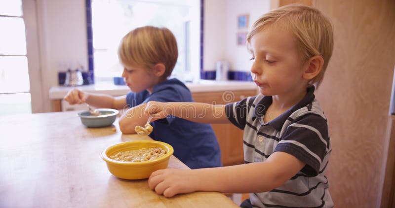 Couple of Cute Young Boys Eating Breakfast Together Stock Image - Image ...