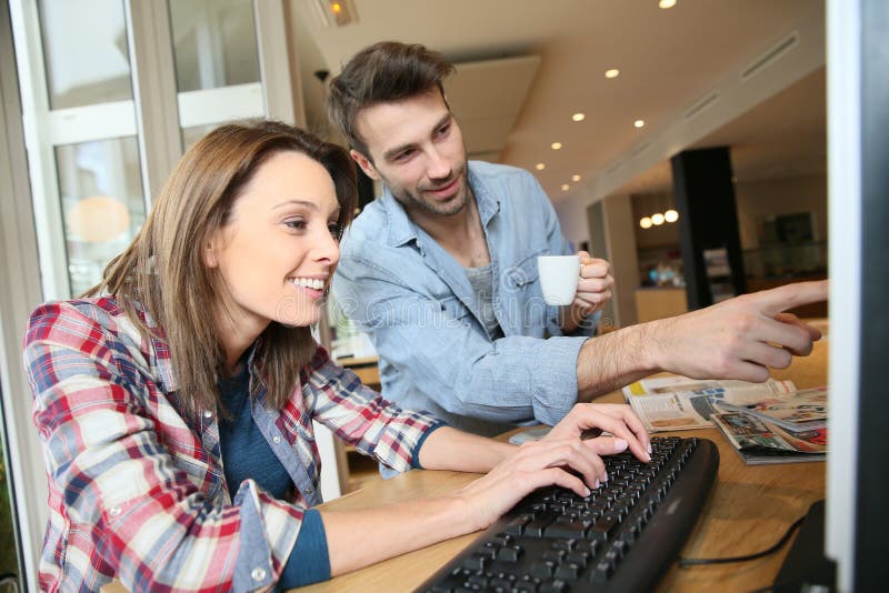 Couple in a Cybercafe Websurfing Stock Image - Image of technology ...