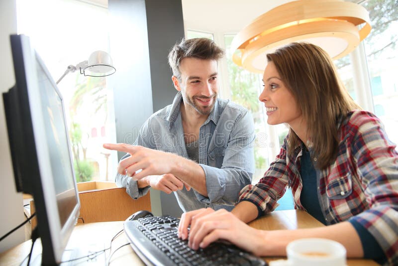 Couple in Cybercafe Websurfing Stock Photo - Image of caucasian, couple ...