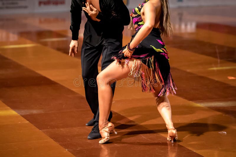 A Couple Dance a Latin Dance. the Legs of a Dancing Couple Stock Photo ...