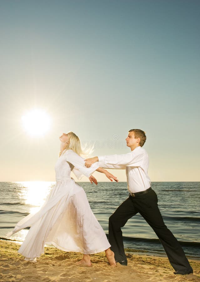 Couple dancing on a beach stock photo. Image of beach - 6765880