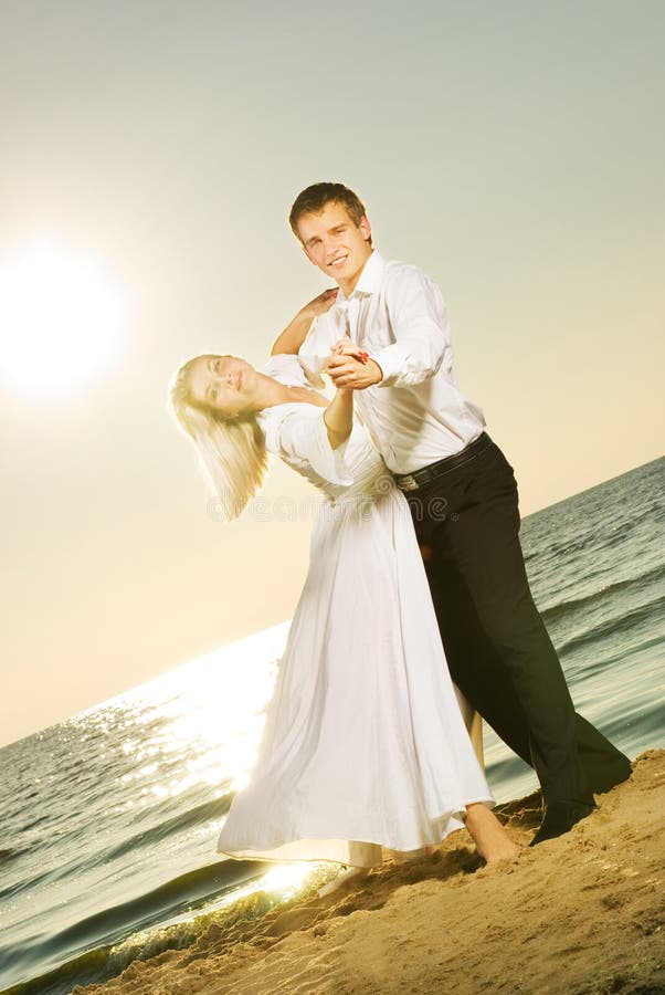 Couple dancing on a beach stock image. Image of emotional - 6765905