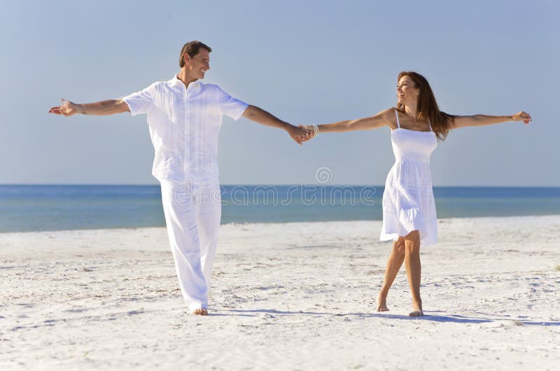 Couple Dancing Holding Hands on a Tropical Beach Stock Photo - Image of ...