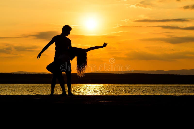 A Couple Dancing by the Sea at Sunset Stock Image - Image of dancing ...