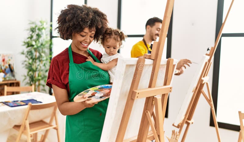 Couple and Daughter Smiling Confident Drawing at Art Studio Stock Image ...