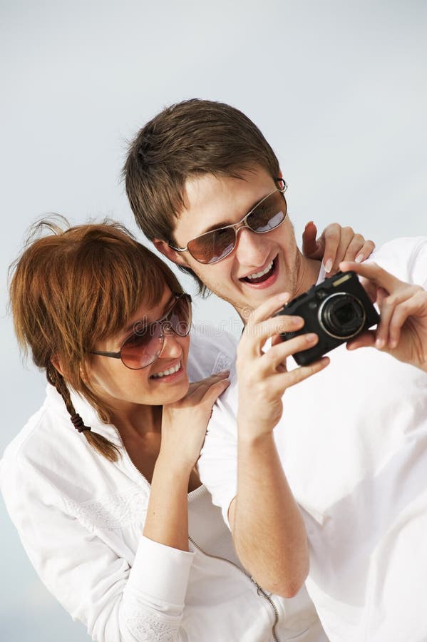 Couple with a Digital Camera Stock Photo - Image of summer, embracing ...