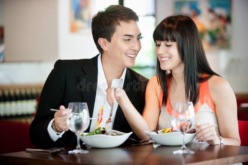 Couple Dining In Restaurant Stock Photo - Image of salad, pretty: 11630900