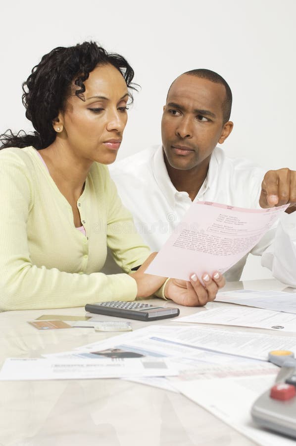 Couple Arguing about Bills stock photo. Image of calculating - 29661144