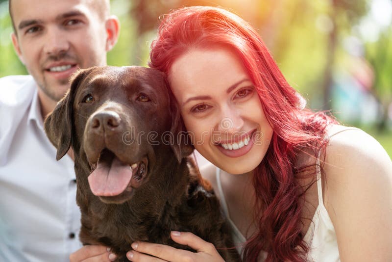 Couple with a Dog in the Park Stock Image - Image of pretty, romance ...
