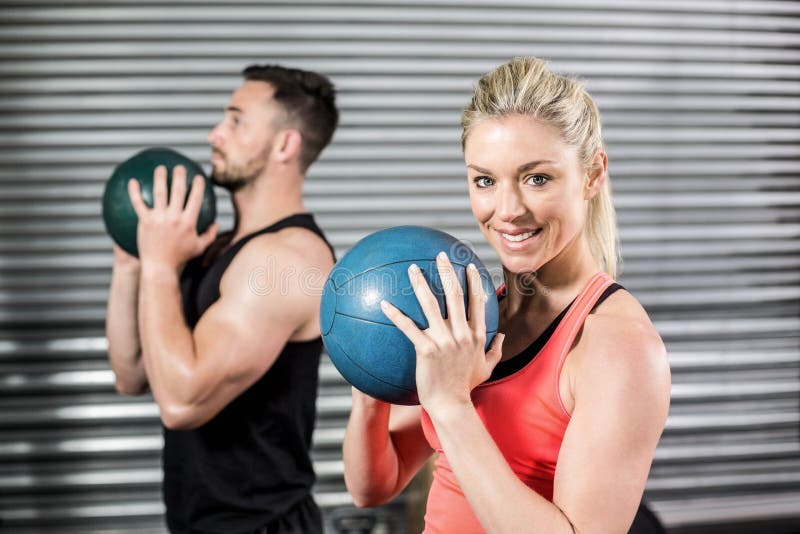 Couple doing ball exercise stock photo. Image of health - 66174938