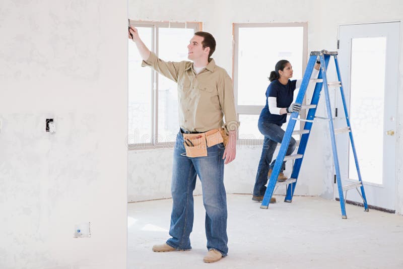 A Couple Doing Building Work Stock Photo - Image of carrying, hispanic ...