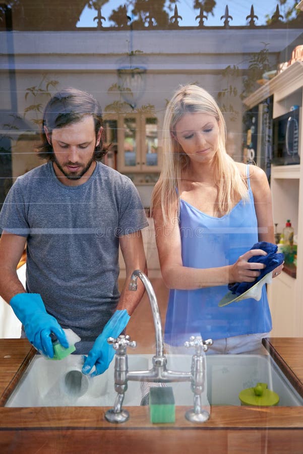 Couple doing the dishes stock photo. Image of kitchen - 60388520