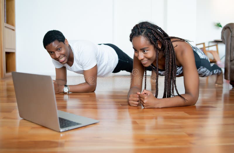 Couple Doing Exercise Together at Home. Stock Photo - Image of covid19 ...