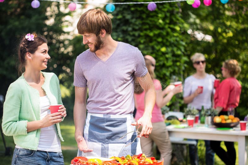Couple doing grill party stock photo. Image of leisure - 56550168