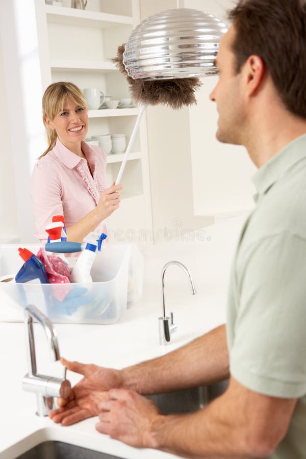 Couple Doing Housework in Kitchen Together Stock Photo - Image of ...