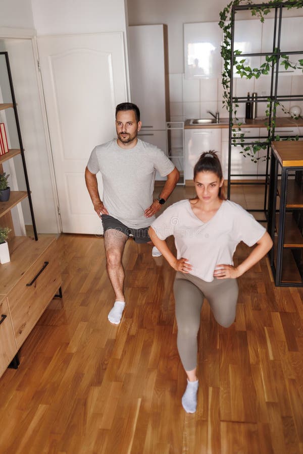 Couple Doing Lunges while Working Out Stock Image - Image of athletic ...