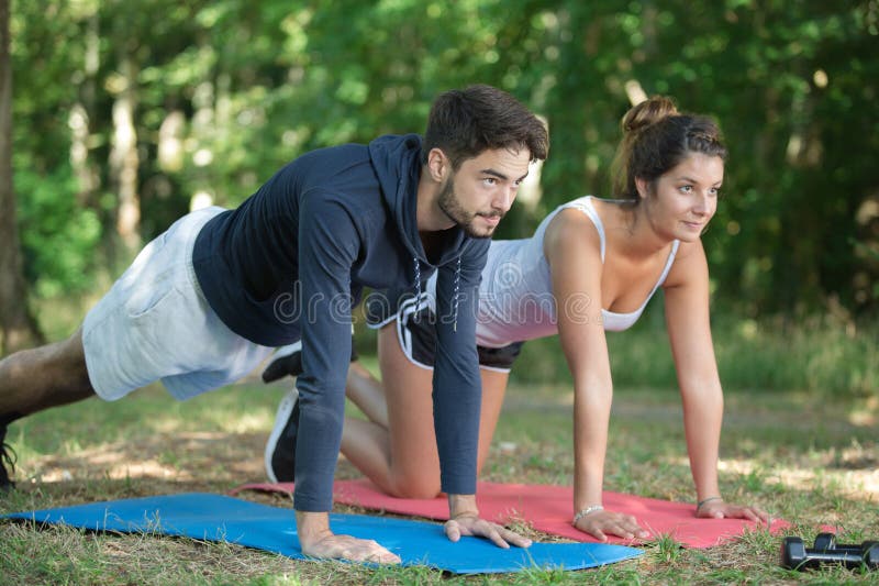 Couple Doing Workout Together in Park Stock Photo - Image of together, grey: 298852448