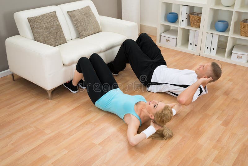 Couple doing workout stock photo. Image of home, exercise - 53171308