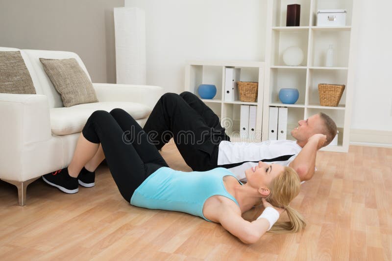 Couple Doing Workout stock photo. Image of lying, handsome - 55845624