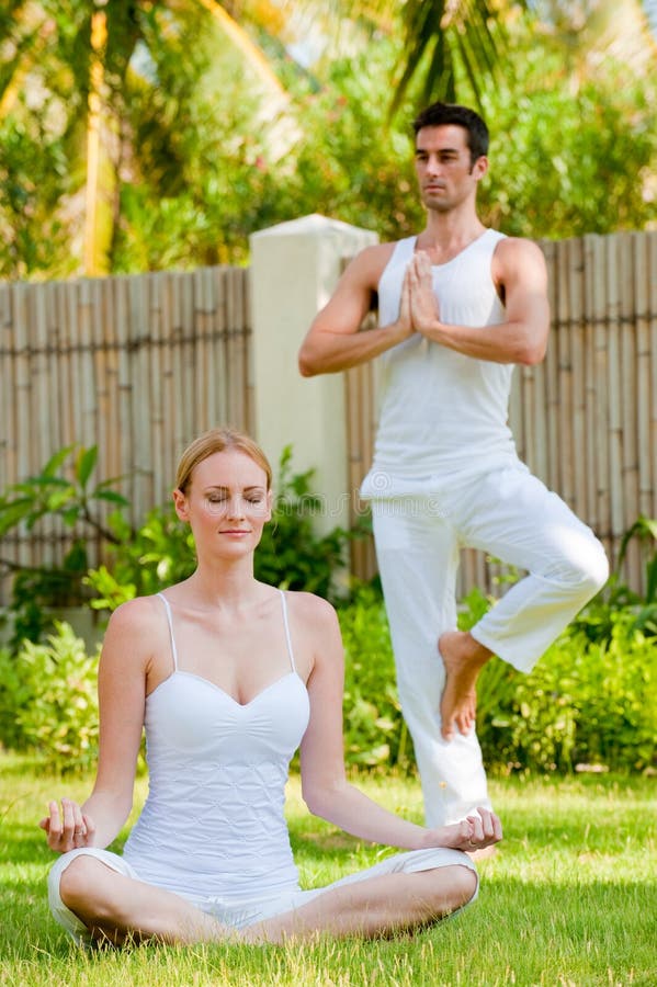 Couple Doing Yoga stock photo. Image of looking, calm - 9548346