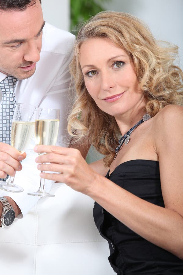 Couple drinking champagne stock photo. Image of cheers - 30742342