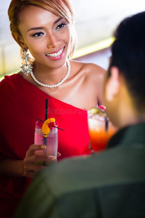 Couple Drinking Cocktails in Fancy Bar Stock Image - Image of woman ...