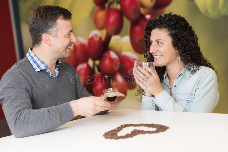 Couple Drinking Coffee Heart Formed on Table with Coffee Beans Stock ...