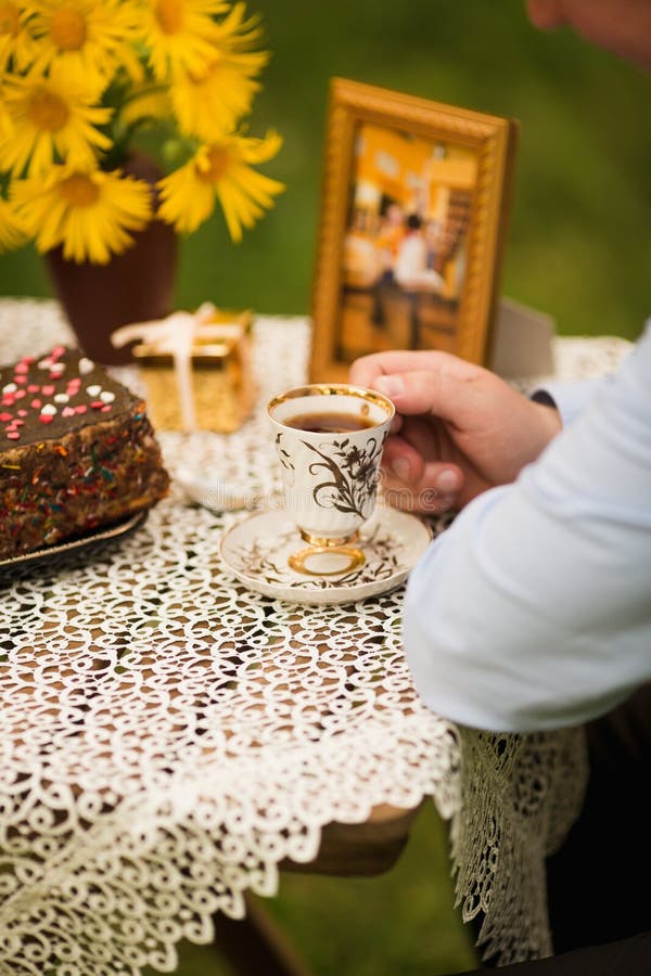 Couple Drinking Tea in the Park Under a Tree Stock Photo - Image of ...