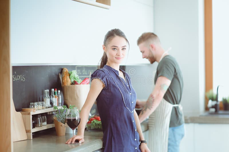 Couple Drinking Wine while Cooking in the Kitchen Stock Photo - Image ...