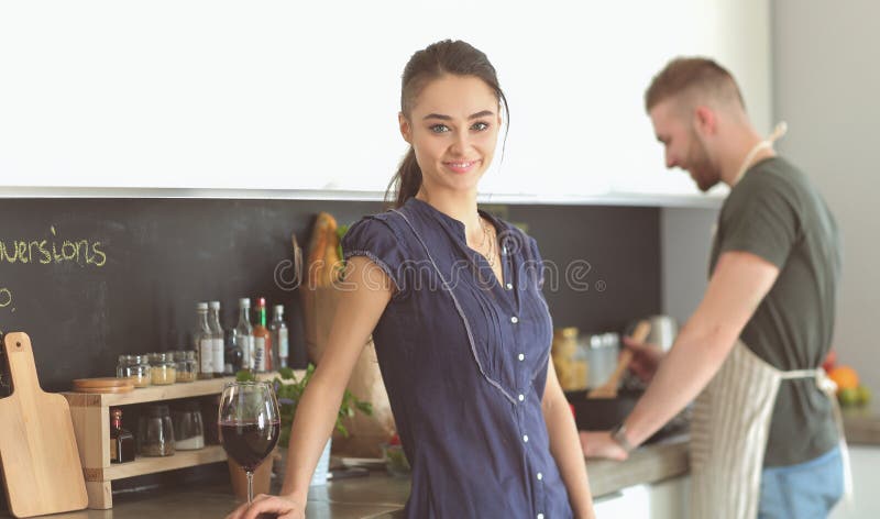 Couple Drinking Wine while Cooking in the Kitchen Stock Image - Image ...