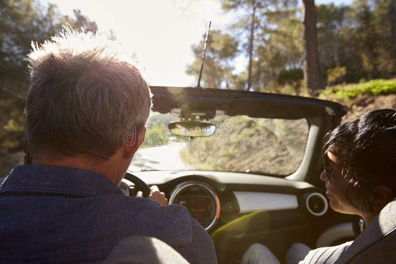 Couple Driving in Open Top Car, Rear Passenger Point of View Stock ...