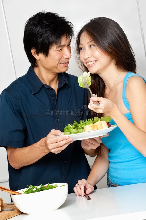 Couple Eating stock image. Image of pretty, interior - 13969157