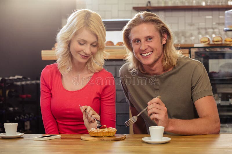 Woman eating a cake alone stock photo. Image of life - 77689200