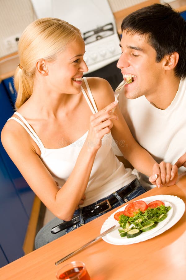 Couple eating at kitchen stock image. Image of girl, home - 3323431