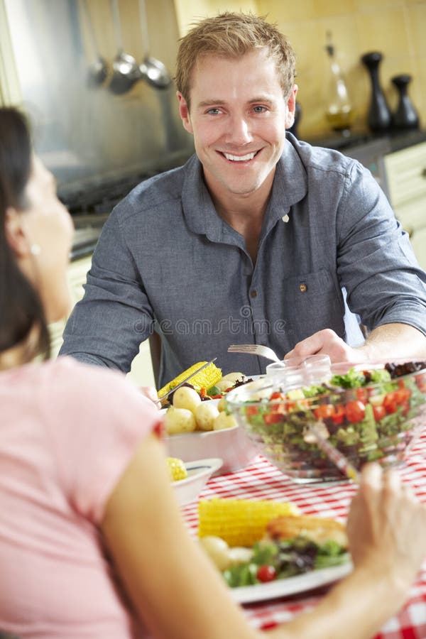 Couple Eating Meal Together in Kitchen Stock Photo - Image of home ...
