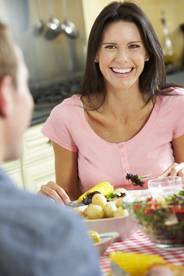 Couple Eating Meal Together in Kitchen Stock Photo - Image of sitting ...