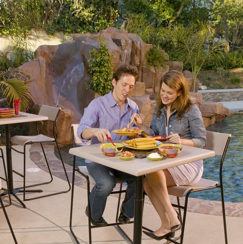 Couple Eating at Poolside 2 Stock Image - Image of date, denim: 14440353