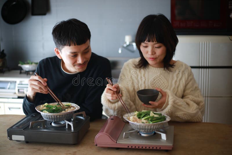 Couple eating a pot stock image. Image of woman, cooking - 241906507