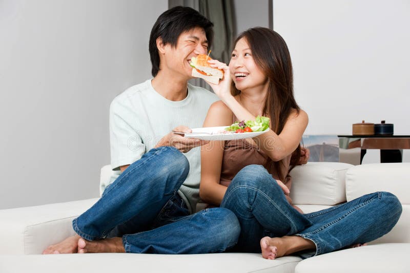 Couple Eating Together stock image. Image of handsome - 13564675