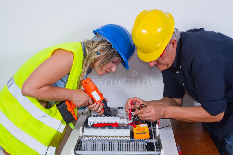 Couple of electrician stock image. Image of panel, installing - 48965619