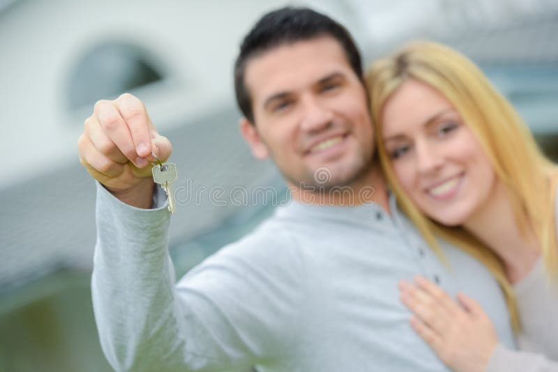 Couple Embracing Man Holding Key Stock Photo - Image of accommodation ...