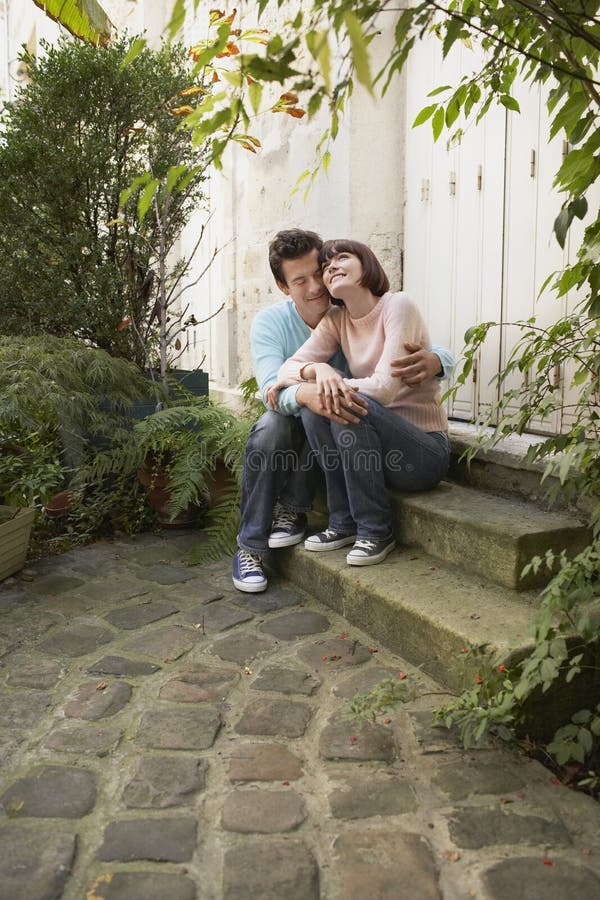 Couple Embracing on Steps stock photo. Image of outdoors - 31840680