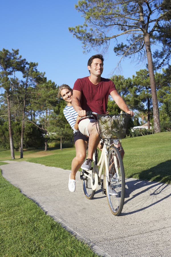 Couple Enjoying Cycle Ride stock image. Image of exercising - 54966075