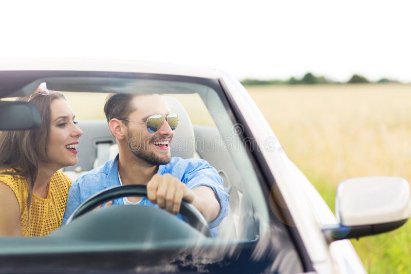 Couple Enjoying a Drive in a Convertible Stock Photo - Image of toothy ...