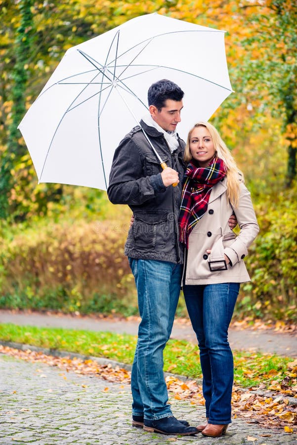 Couple Enjoying Fall Day Having Walk Despite the Rain Stock Photo ...