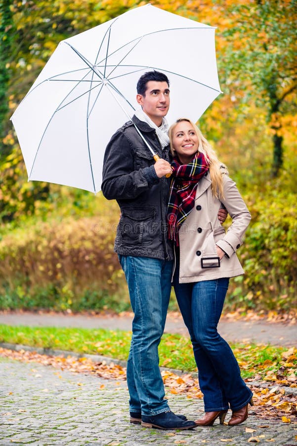 Couple Enjoying Fall Day Having Walk Despite the Rain Stock Image ...