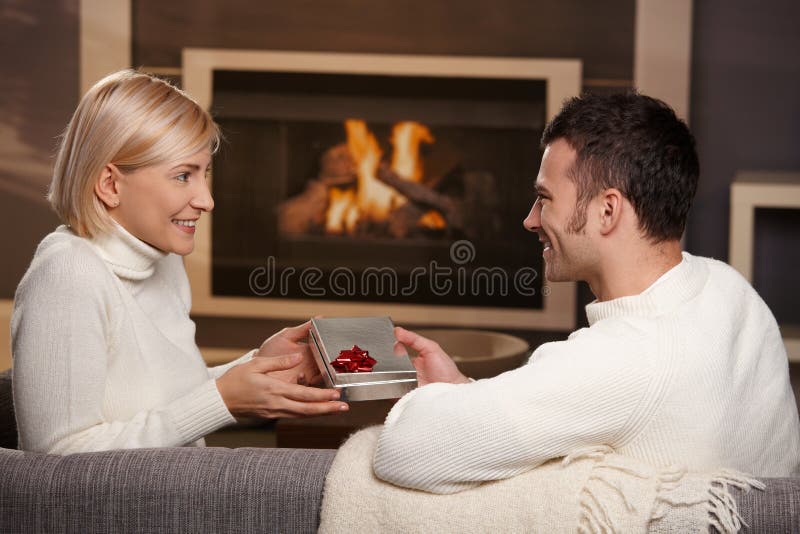 Couple Exchanging Gift At Home Stock Image - Image of gift, face: 12145993