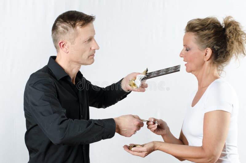 Couple Exchanging Money Against Chocolate Stock Image - Image of ...