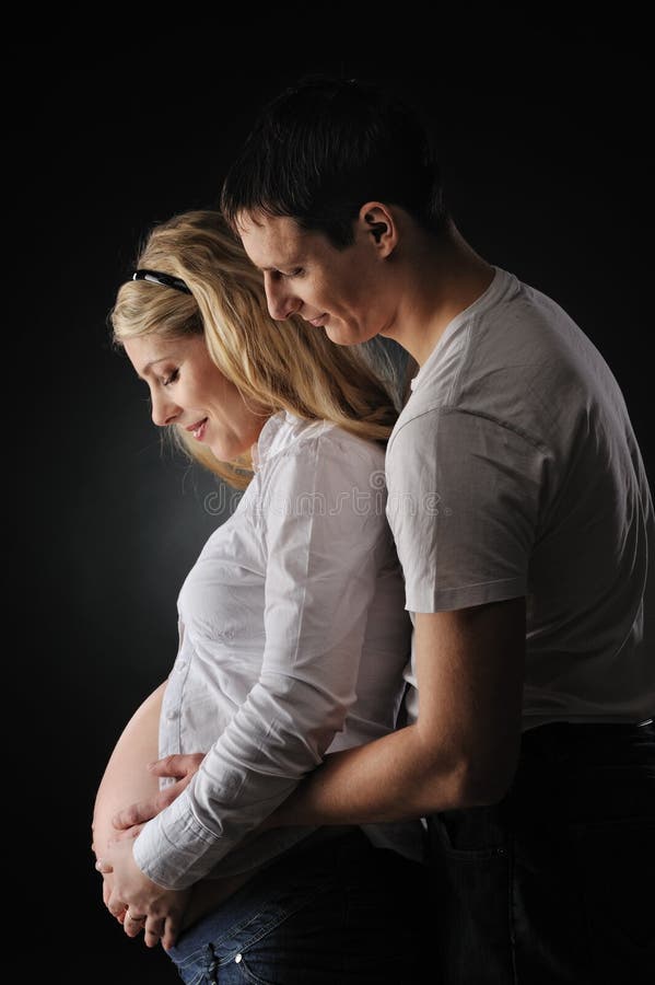 Couple expecting a baby stock image. Image of holding - 14052043